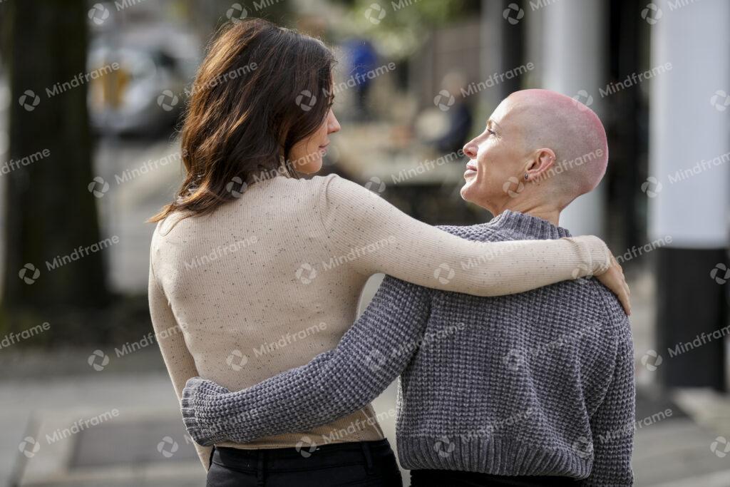 Two people walking, arm in arm – Mindframe online image collection