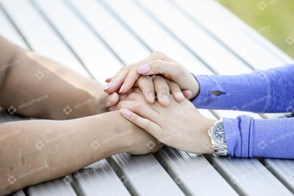 Two people’s hands together – Mindframe online image collection