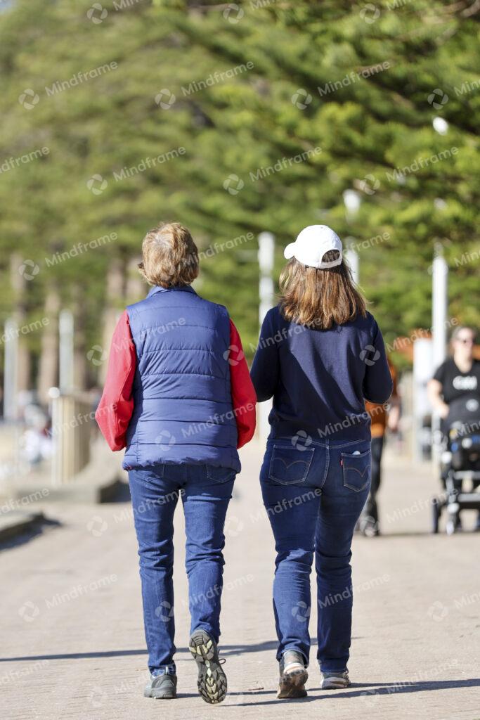 Two people walking along path – Mindframe online image collection