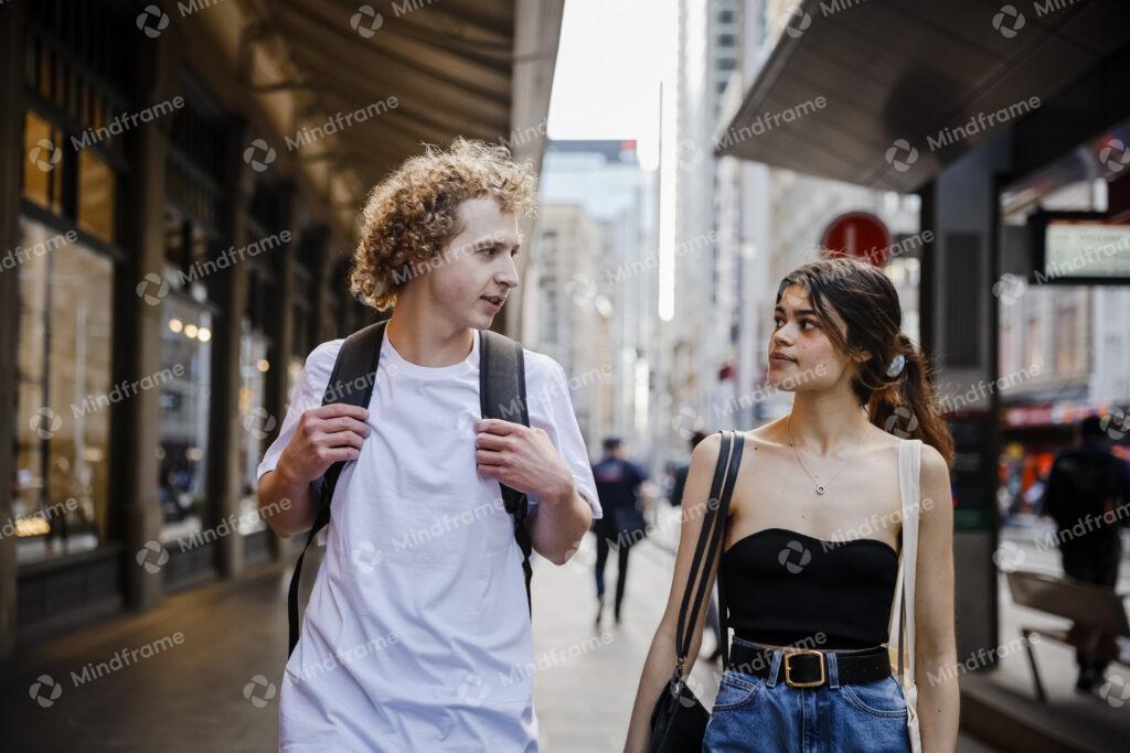 Two people walking and talking on a city street – Mindframe online ...