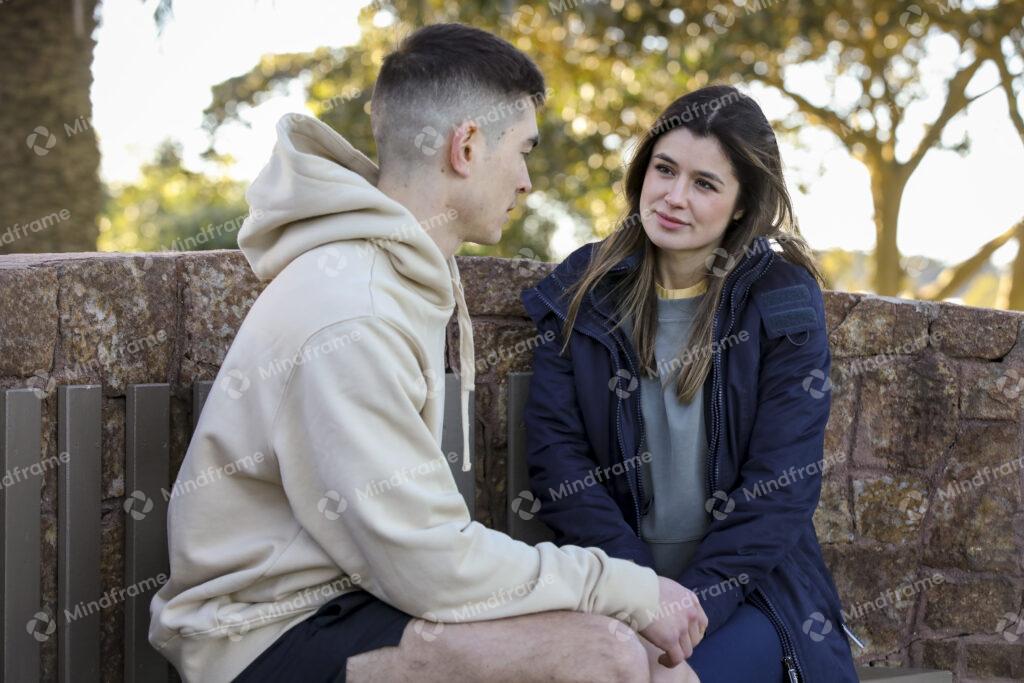 Two people talking and sitting on bench in park – Mindframe online ...
