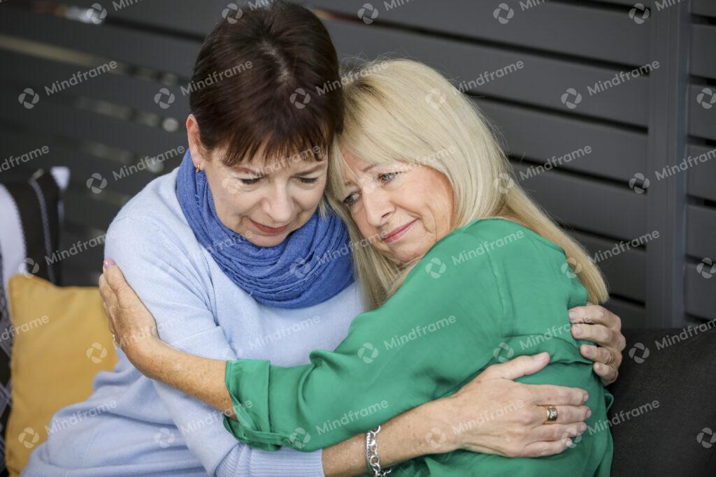 Two women embracing… – Mindframe online image collection