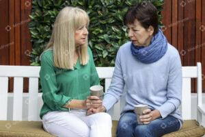 Two people sitting and talking – Mindframe online image collection