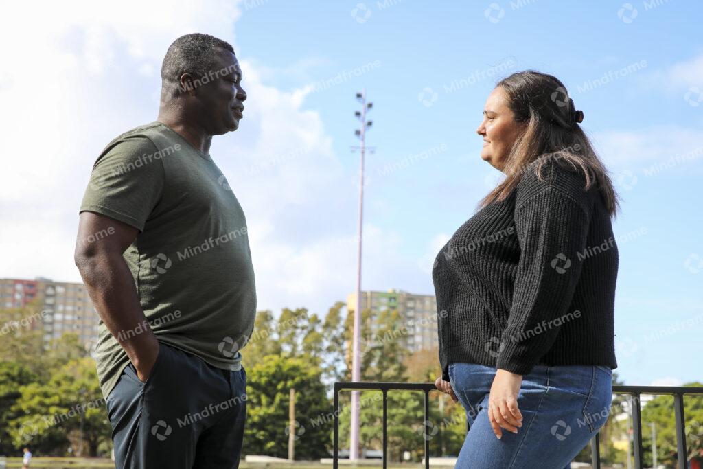 Two people standing and talking – Mindframe online image collection