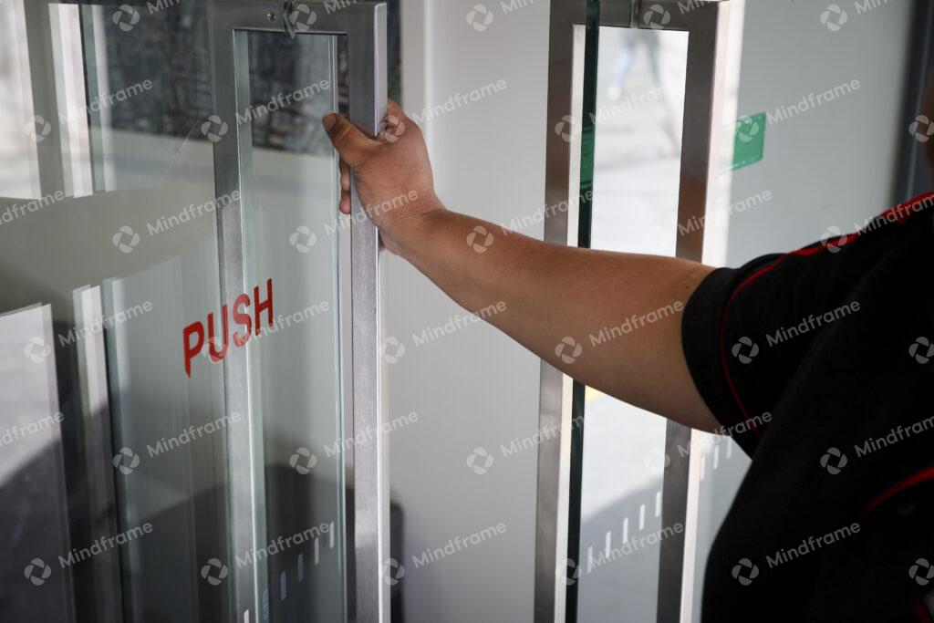 Person opening door to support service – Mindframe online image collection